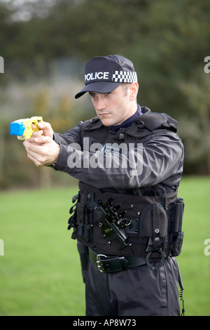 Humberside police firearms officer demonstrates the Taser gun. The X26 ...