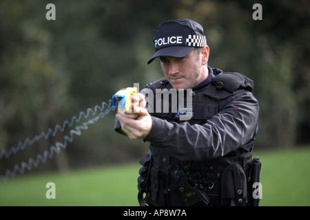 Humberside police firearms officer demonstrates the Taser gun. The X26 ...