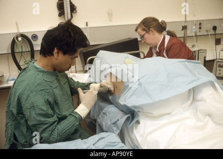 Epidural administered by anaesthetist in preparation for a caesarean ...
