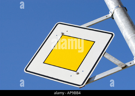 yellow and white right of way traffic sign Stock Photo - Alamy
