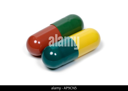Green and yellow capsules Two medication pills with foil pack Stock ...