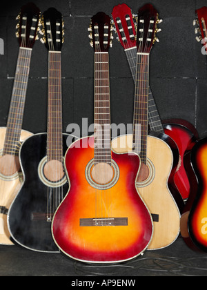 Acoustic six-string guitars in a music store Stock Photo - Alamy