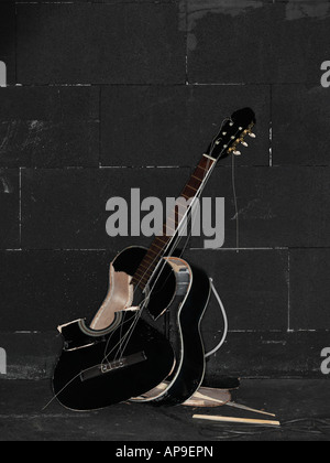 A smashed and broken acoustic guitar Stock Photo - Alamy