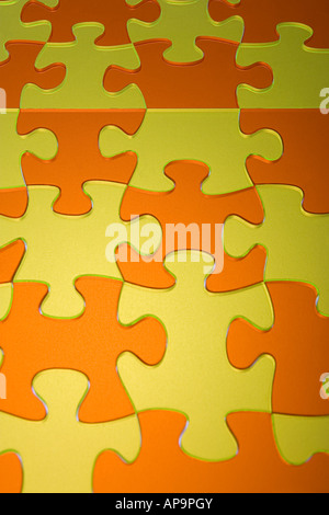 orange jigsaw puzzle pieces Stock Photo - Alamy