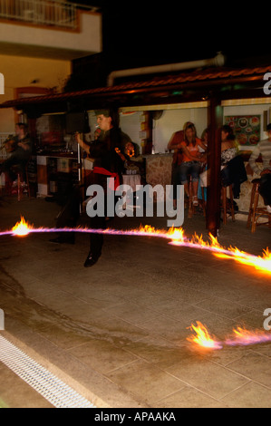A Cretan dancer seen doing the Greek Fire Dance for holidaymakers ...
