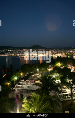 Holiday resort by night in Kusadasi, Turkey. Aegean Sea and beach in ...