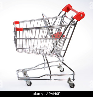 Small metal shopping cart on yellow background, top view. Space for ...