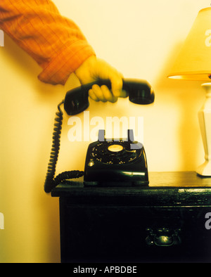 upset old man with retro telephone on yellow background Stock Photo - Alamy