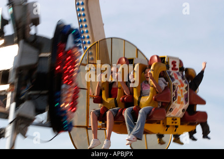 People on a Booster Bomber ride at a fairground, UK Stock Photo - Alamy