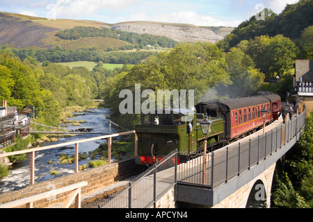 A steam train crossing a viaduct at Berwyn station on Llangollen ...