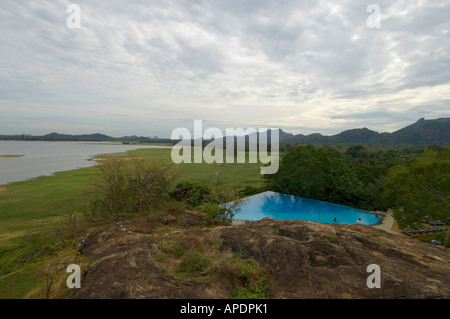 Kandalama Hotel swimming pool, looking to tank (reservoir) near ...