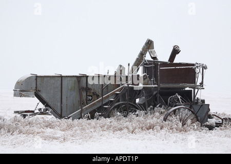Old threshing machine in winter Stock Photo - Alamy