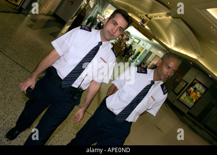 Security guards patrolling Lewisham Shopping Centre London London UK ...