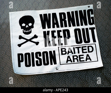 Sign with skull and crossbones warning of rat poison in the area ...