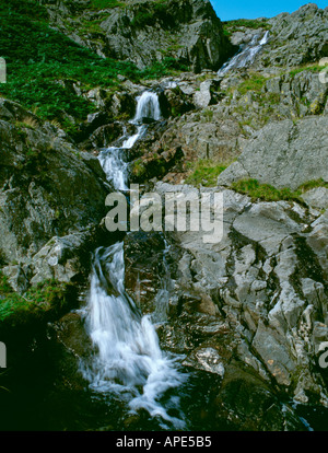 Waterfall tumbling over rocks above Haweswater, Lake District National ...