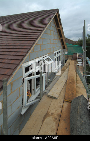 House with windows fitted into roof Stock Photo - Alamy