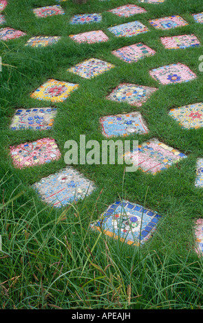 Spiral garden path made from handmade tiles Stock Photo - Alamy