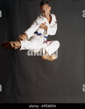 Martial arts flying side-kick demonstration in Dojo Stock Photo - Alamy