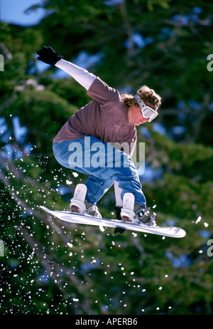 Male snowboarder is balancing on his board in mountains Stock Photo - Alamy