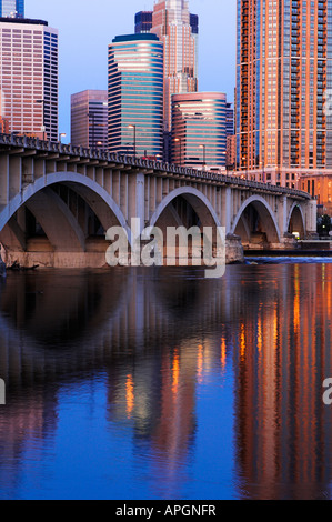 Downtown Minneapolis at sunrise viewed accross the Mississippi river ...
