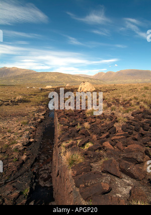 Stacking turf in the bog Stock Photo - Alamy
