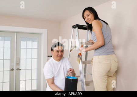 Asian Father and Daughter Painting Stock Photo - Alamy