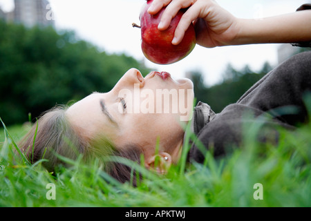 Sexy woman kissing an apple Stock Photo - Alamy