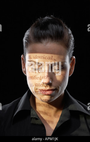 Text projected on woman's face Stock Photo - Alamy