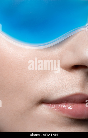 Young women covering their faces with masks Stock Photo - Alamy