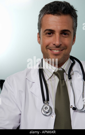 Handsome hispanic man working as doctor writing pills presciption at ...