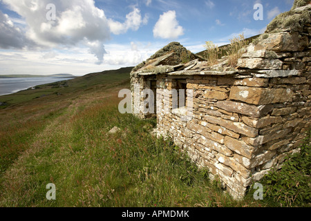 Deserted cottage over looking the Eynhallow Sound Rousay Orkney ...