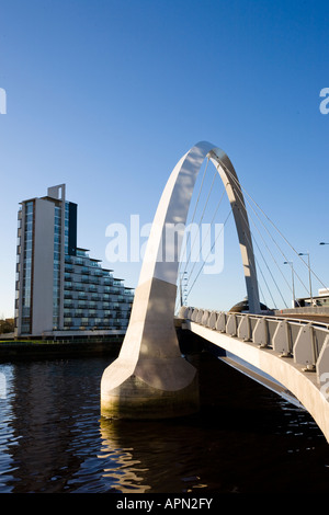 Modern arc bridge over the river, day traffic, summer time. modern ...