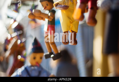 Clown Marionette puppets on strings dancing with a black background ...
