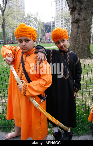 Sikh boys in traditional dress attend a religious festival to celebrate ...