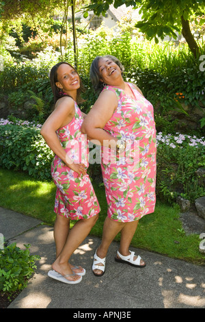 Two generations of women, smiling at camera Stock Photo - Alamy