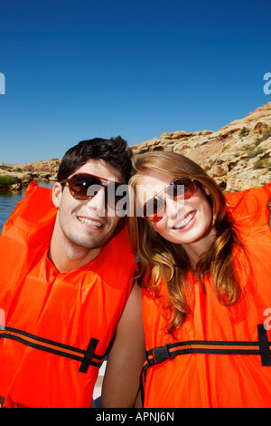 Young woman wearing life jackets Stock Photo - Alamy
