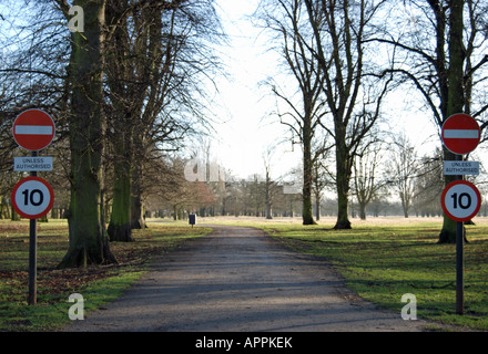 a british no entry sign, a speed limit sign, and a notice restricting ...