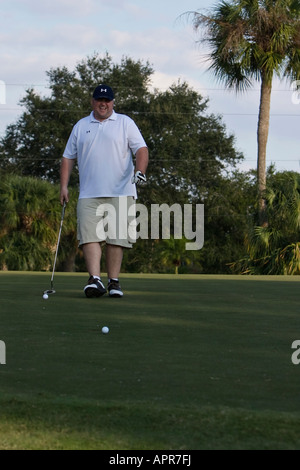 a fat man playing golf Stock Photo - Alamy