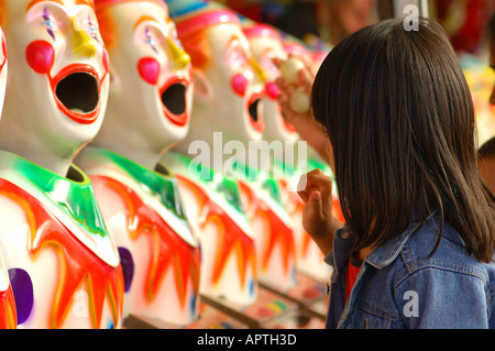 Fun fair clowns at side show alley Stock Photo - Alamy