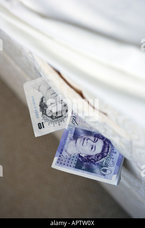 Money under the mattress Stock Photo - Alamy