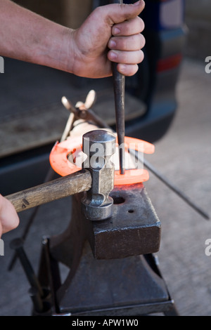 The Smithy (blacksmith) at work at his anvil in Dent, Yorkshire ...