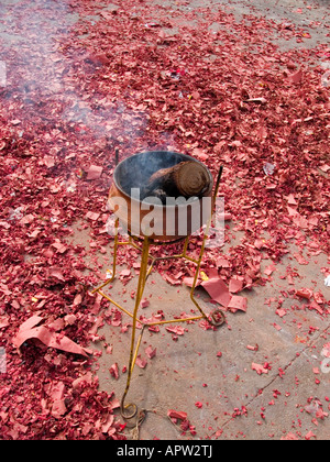 the leftovers from fireworks set off at a Chinese shrine at the bizarre ...