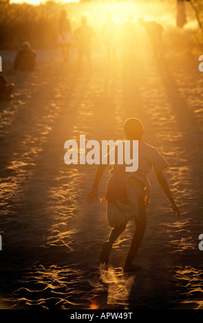 Bushman children playing in the sand Den ui village Bushmanland Namibia ...