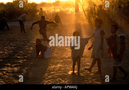 Bushman children playing in the sand Den ui village Bushmanland Namibia ...