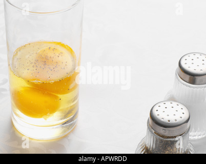 three egg yolk in a glass bowl isolated on white background with ...