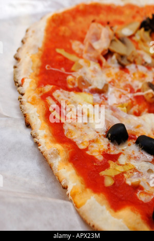 Detail of a pizza on display in a window, selective focus Stock Photo ...
