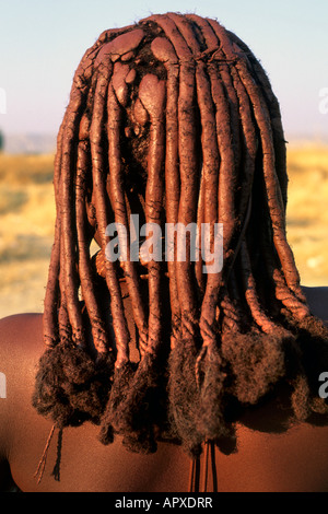 Women from Himba people in traditional clothes and haircuts are ...