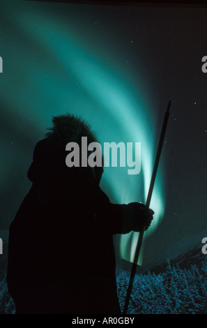 Eskimo man viewing Northern lights Alaska composite scenic Stock Photo ...