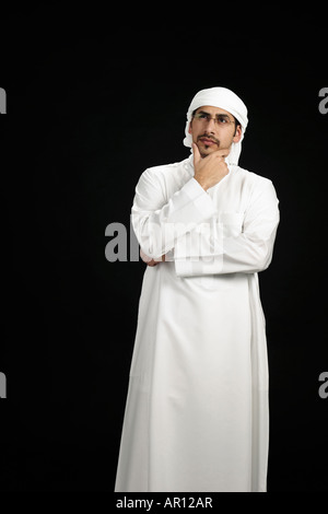 Arab man thinking something Stock Photo - Alamy