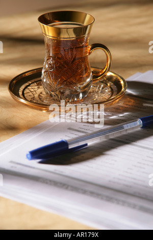 Cups of tea and forms Stock Photo - Alamy